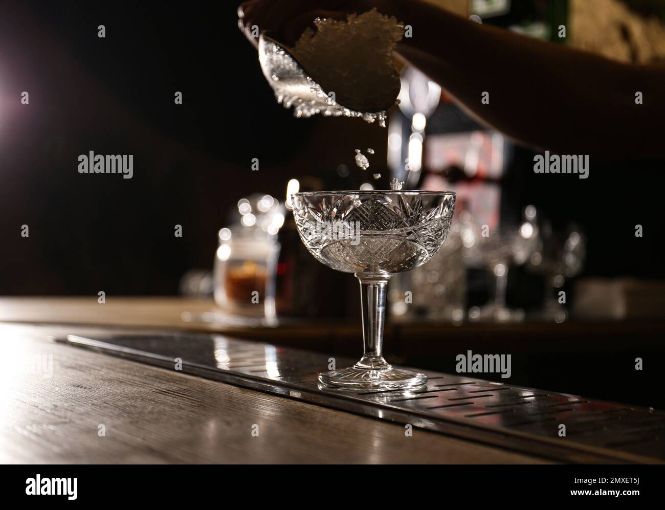 Bartender preparing fresh alcoholic cocktail at bar counter, closeup ...