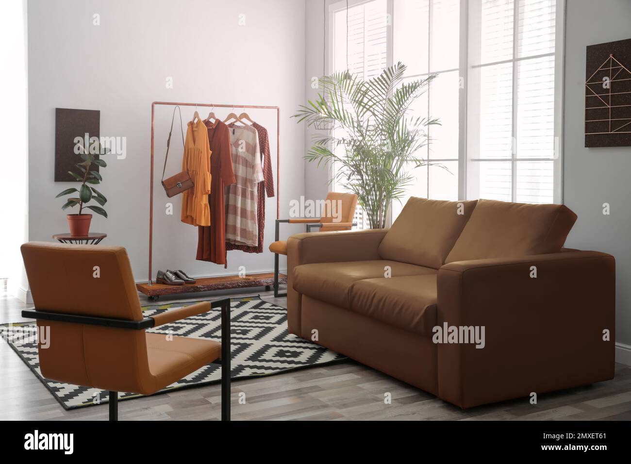 Modern living room interior with stylish leather sofa Stock Photo - Alamy