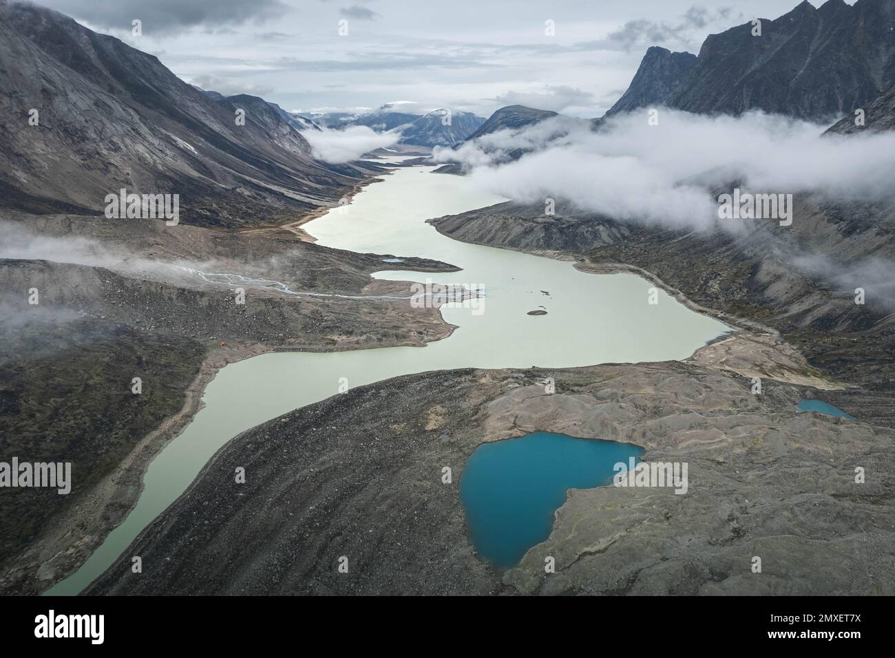 Southwest face of Mt. Thor, highest vertical cliff on Earth, on a ...