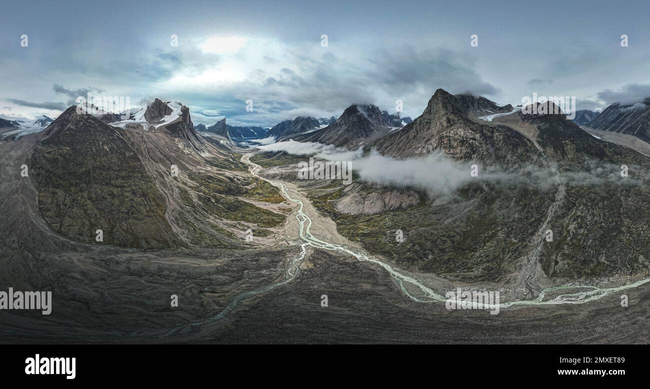 Southwest face of Mt. Thor, highest vertical cliff on Earth, on a ...