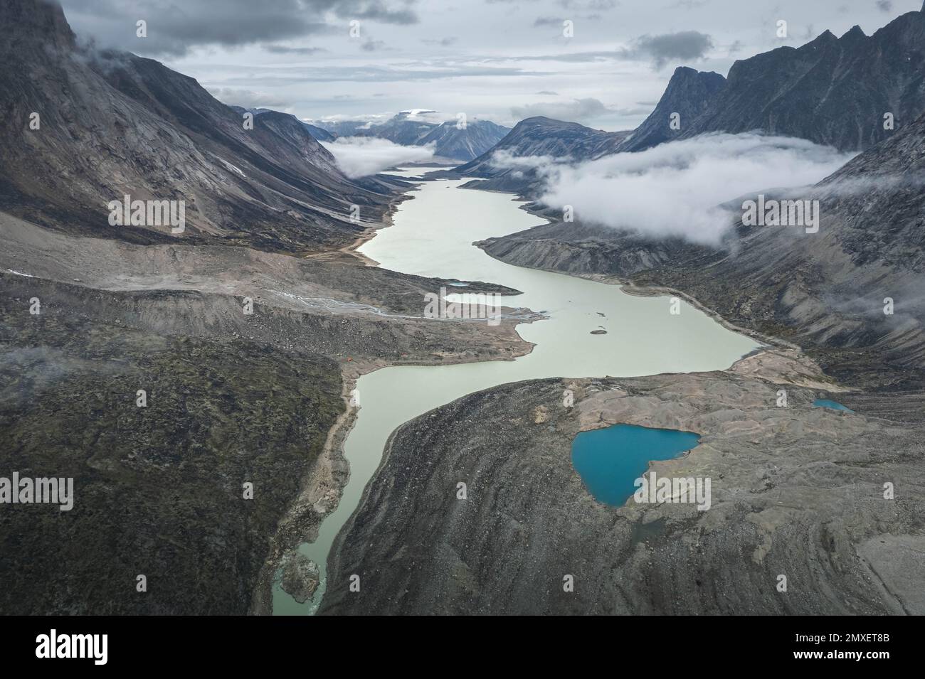 Southwest face of Mt. Thor, highest vertical cliff on Earth, on a ...