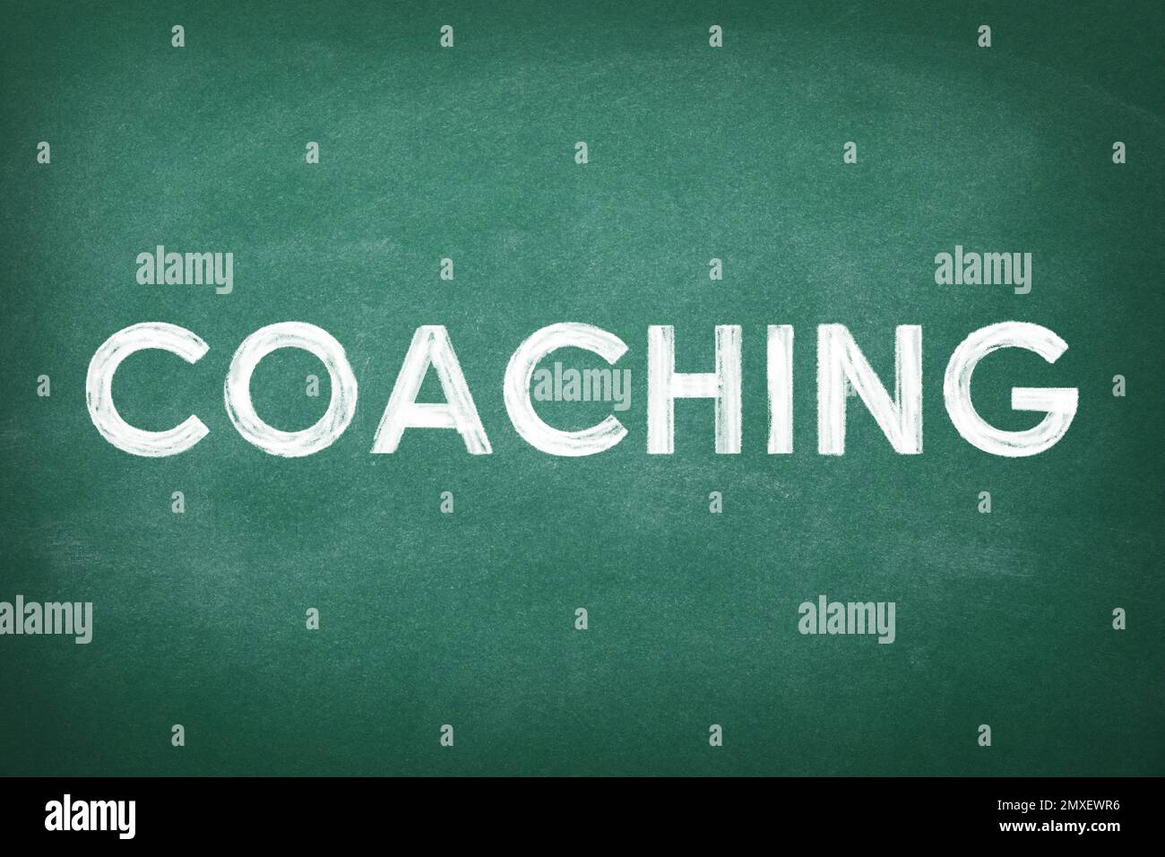 Adult learning. Word COACHING written on green chalkboard Stock Photo ...