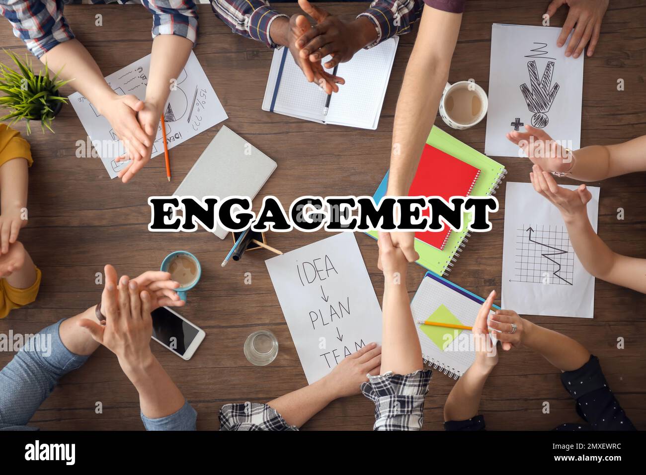 Engagement concept. People working together at table, top view Stock ...