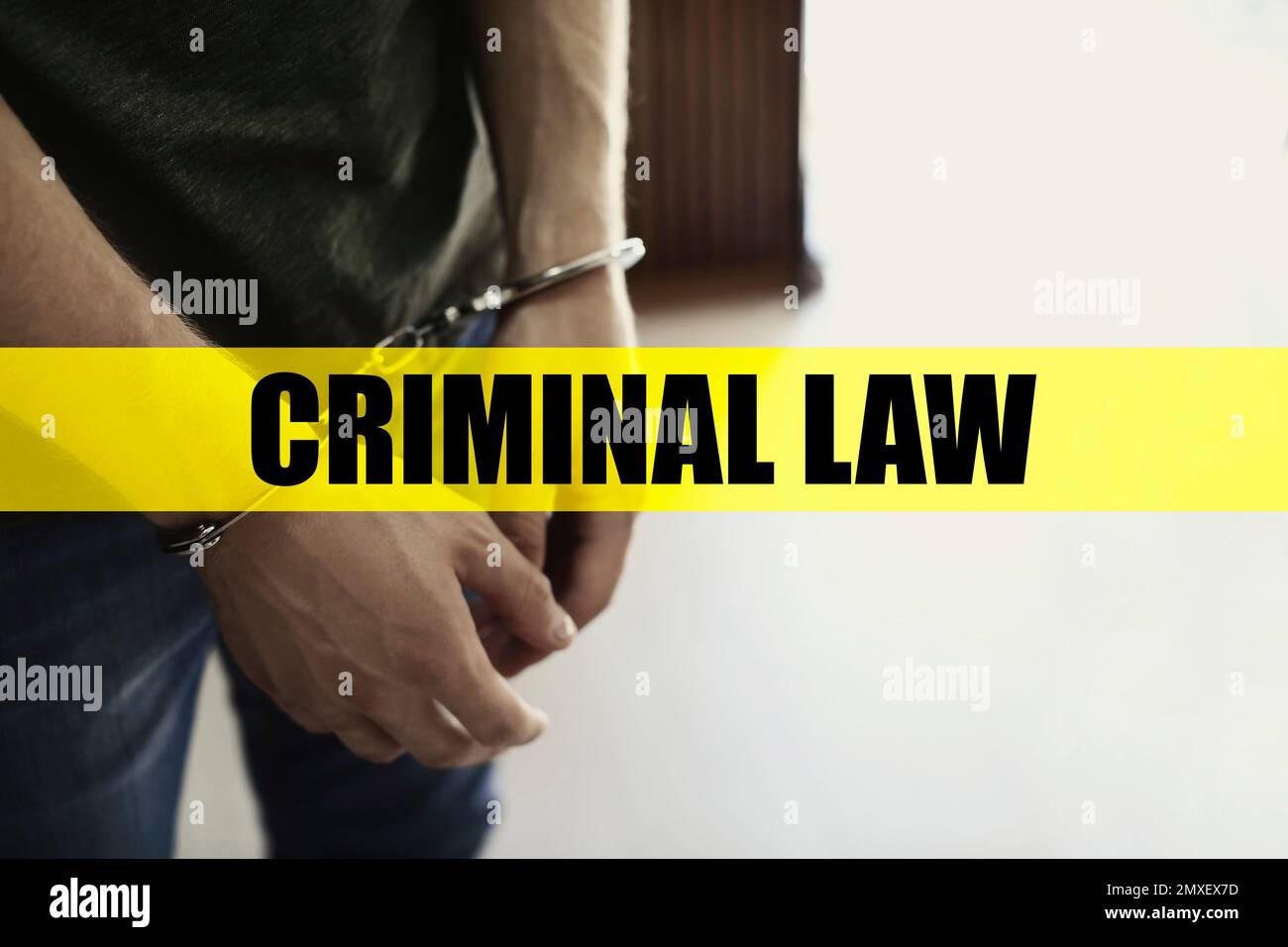 Man detained in handcuffs indoors. Criminal law concept Stock Photo - Alamy