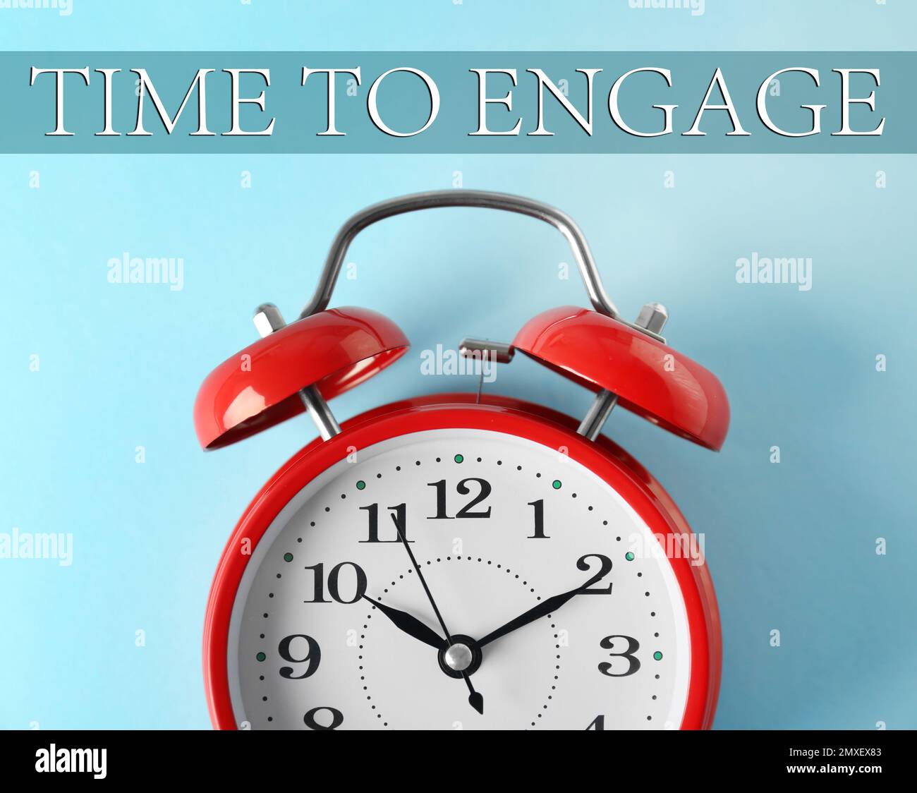 Alarm clock and phrase TIME TO ENGAGE on light blue background, closeup ...