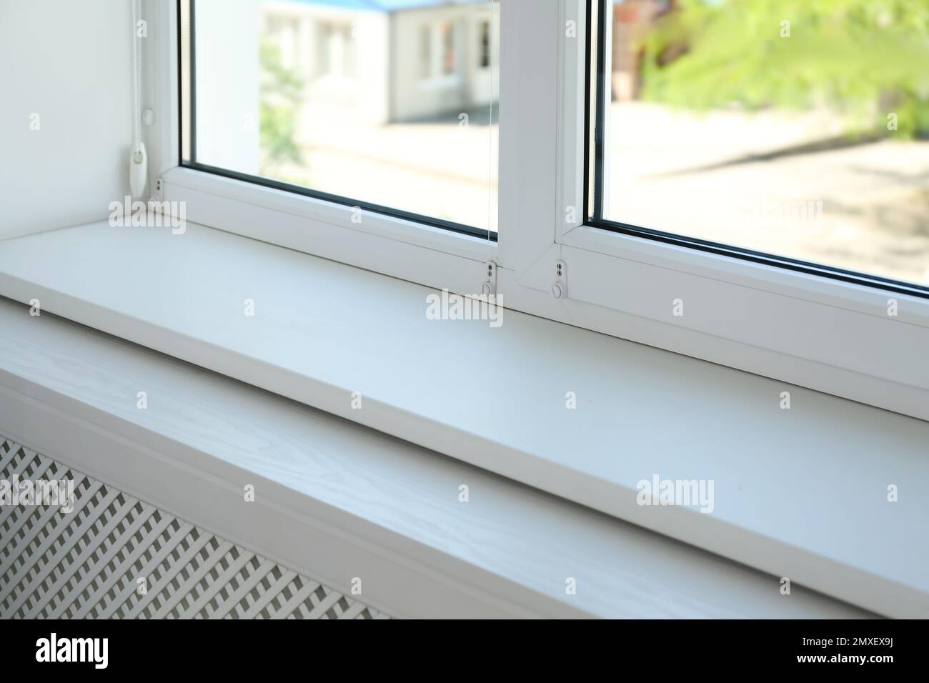 Closeup view of window with empty white sill Stock Photo - Alamy