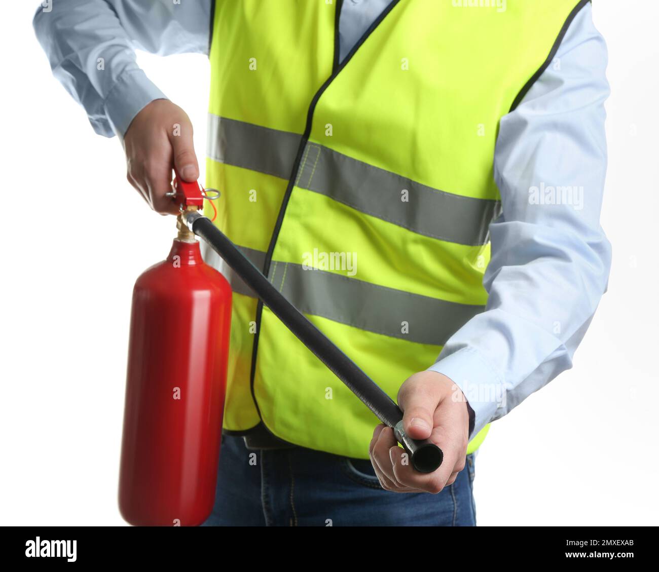 Worker using fire extinguisher on white background, closeup Stock Photo ...