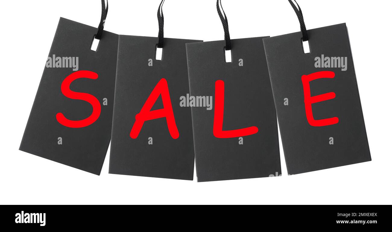 Cardboard tags with word SALE on white background Stock Photo - Alamy
