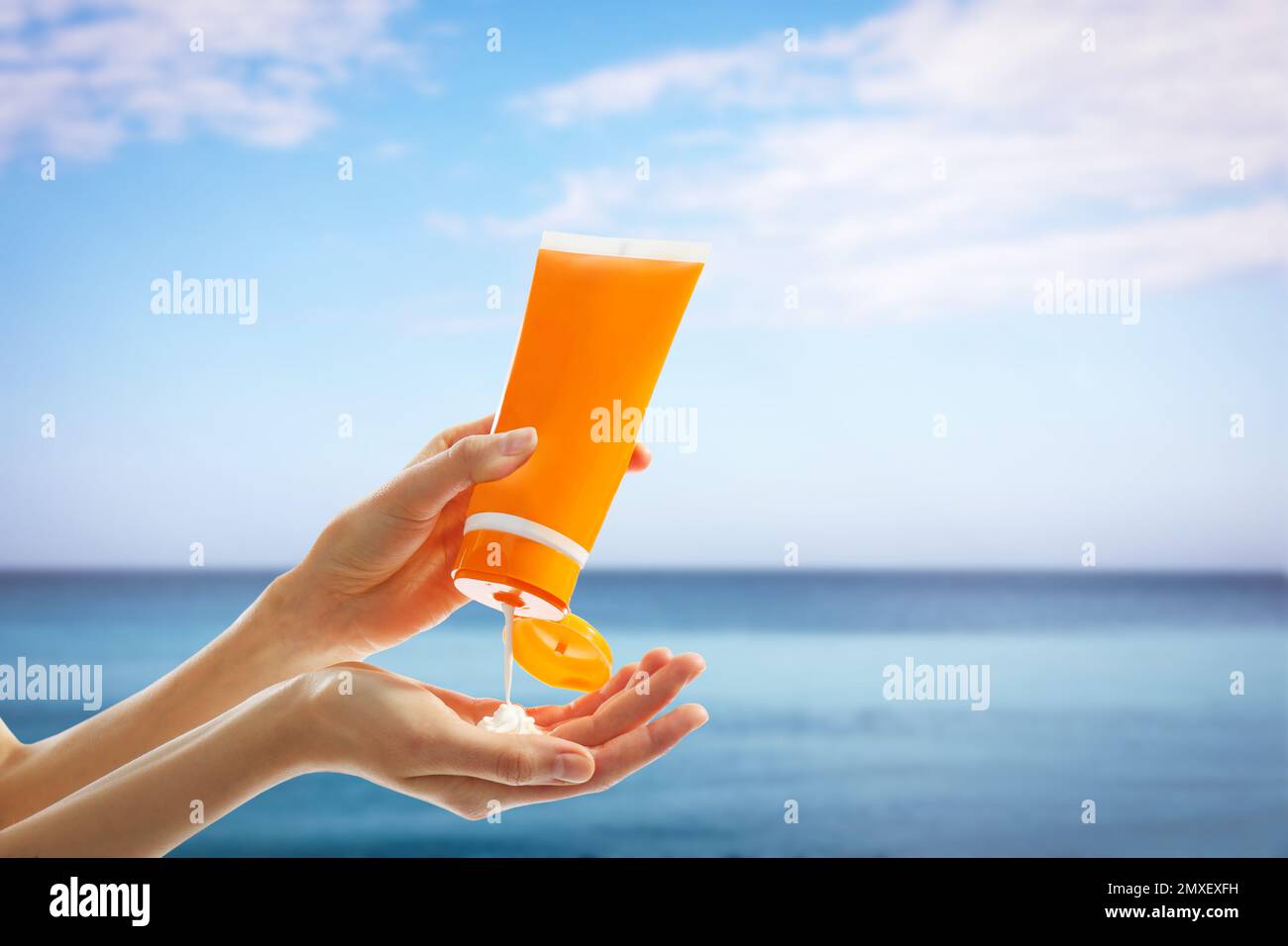 Apply applying suncream hi-res stock photography and images - Alamy