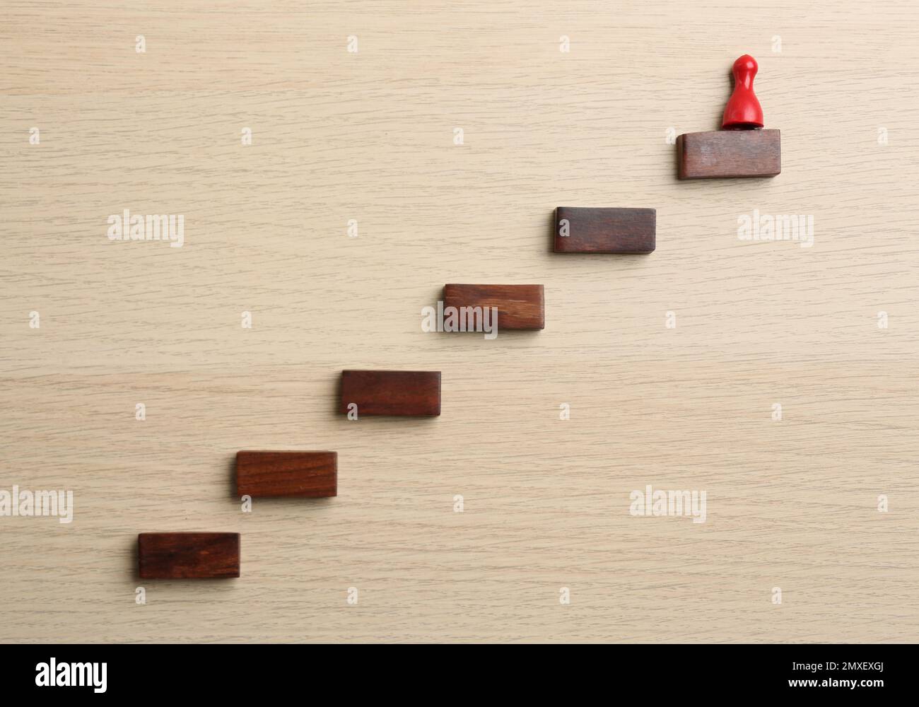 Red piece on top of stairs, flat lay. Career promotion concept Stock ...