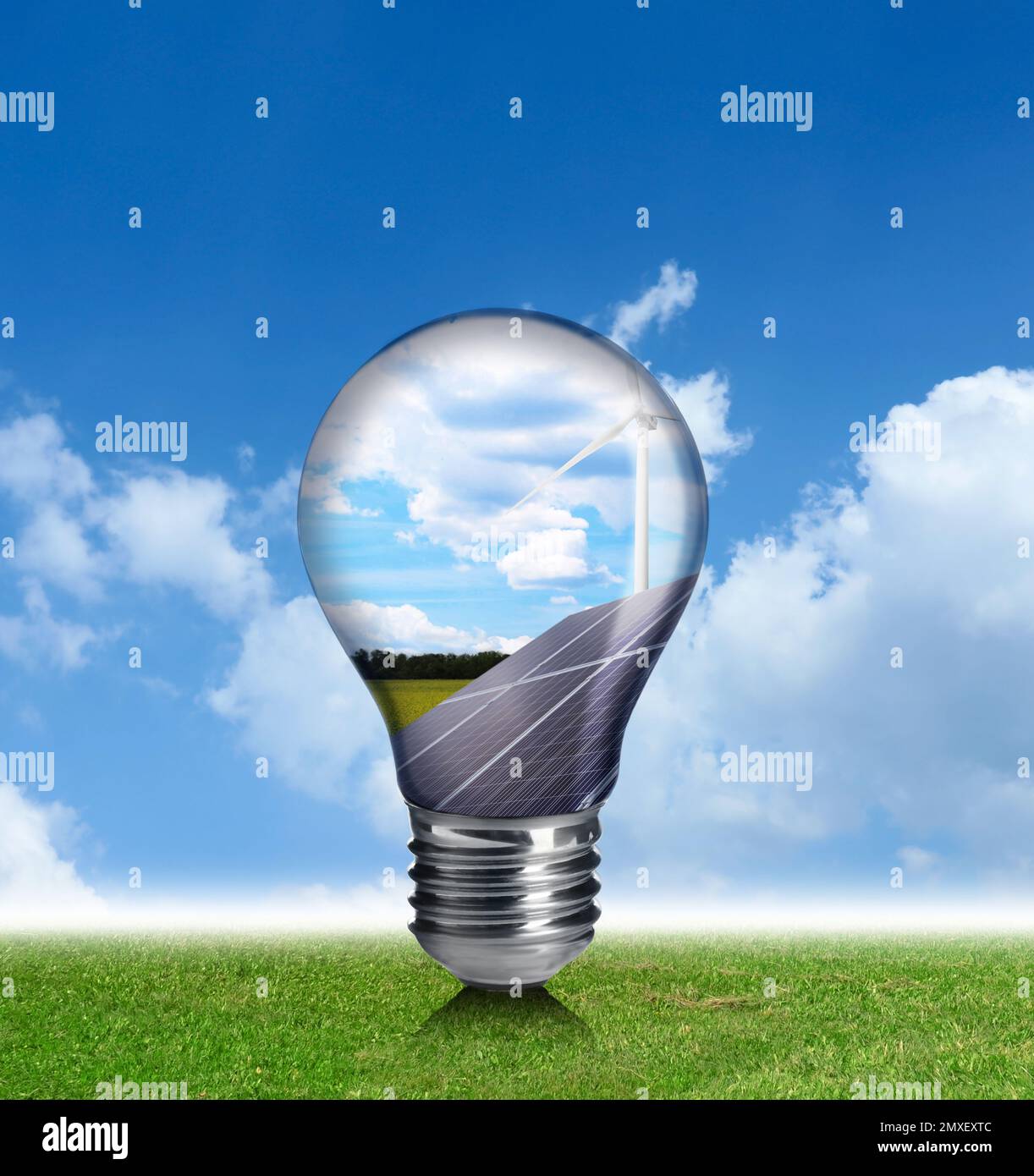 Alternative energy source. Light bulb with solar panels and wind ...