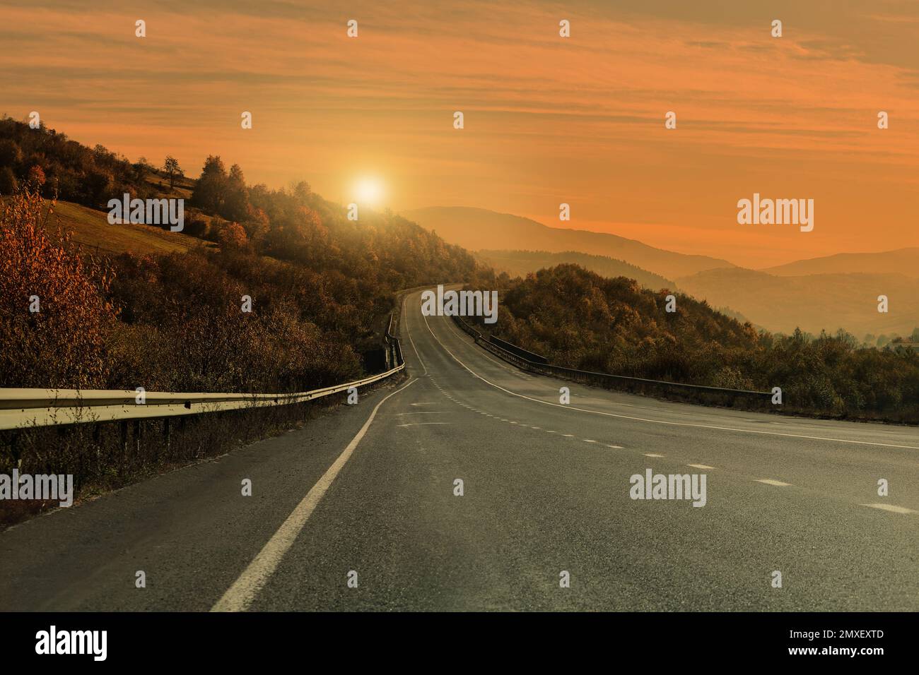 Road trip. Beautiful view of asphalt highway at sunset Stock Photo - Alamy