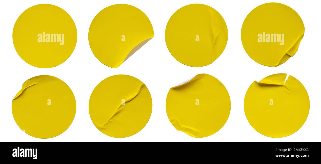 A set of blank yellow round adhesive paper sticker label isolated on ...