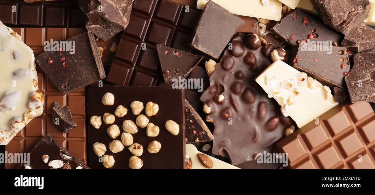 Many different delicious chocolate bars as background, top view. Banner ...