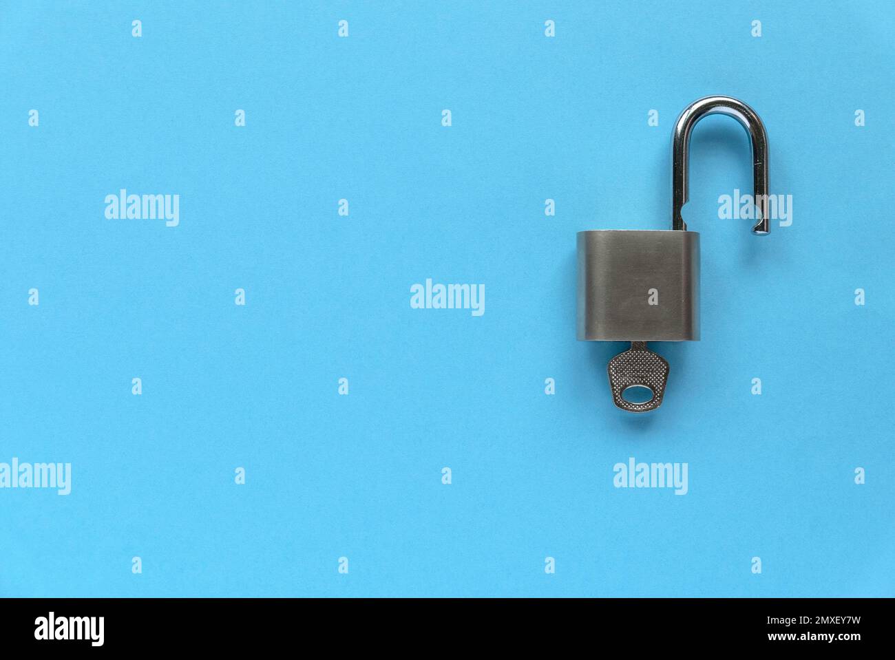 Computer security concept. Unlocked padlock on blue background with ...