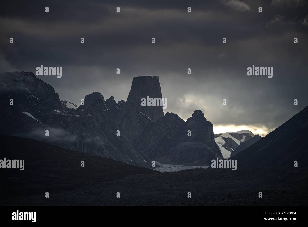 Iconic granite rock of Mt.Asgard towers above Turner glacier in remote ...