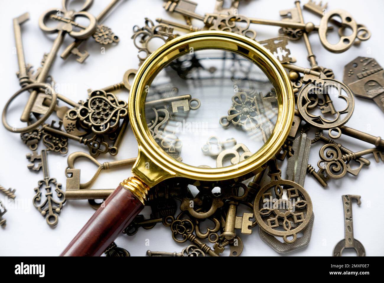 Magnifying glass and a bunch of keys. Concept of search for solution ...