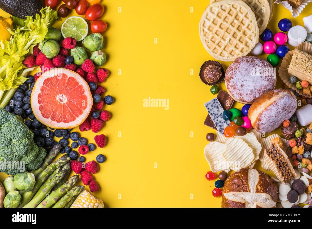Healthy and unhealthy food concept. Fruits and vegetables vs sweets top ...
