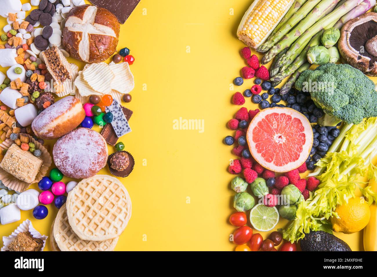 The concept of healthy and unhealthy food. Top view of fast food and ...