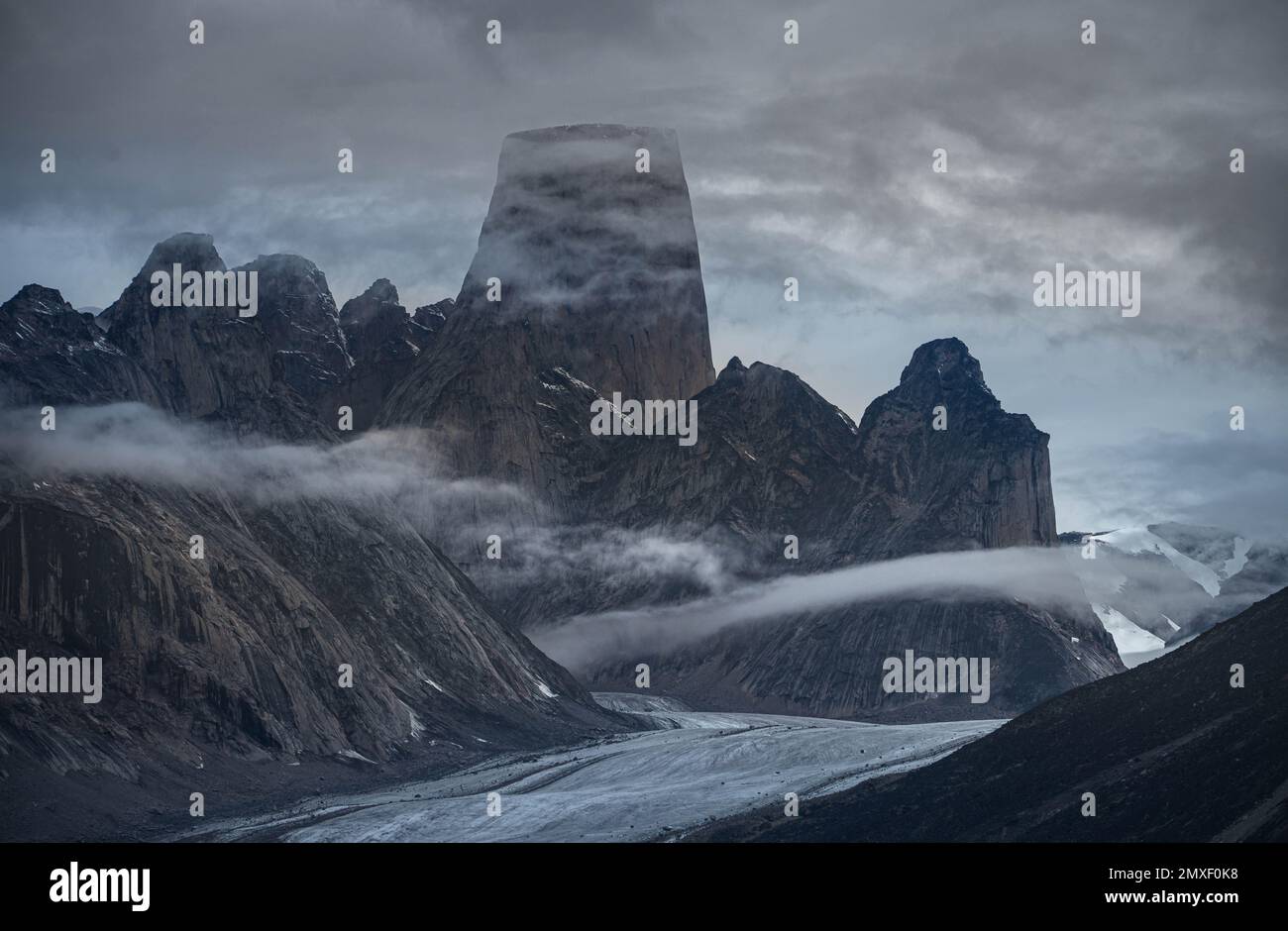 Iconic granite rock of Mt.Asgard towers above Turner glacier in remote ...