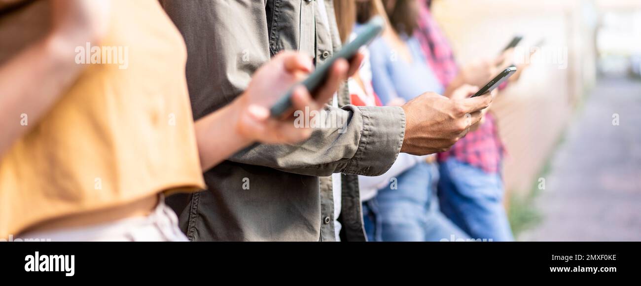 Horizontal banner with bored friends group using smartphone sitting at ...