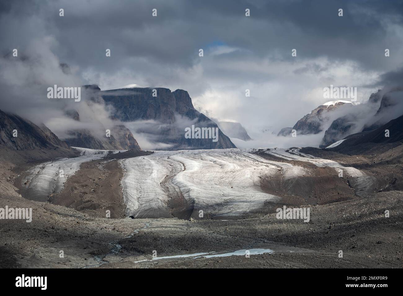The tongue of Tupermit Glacier in Akshayuk Pass. Auyuittuq National ...