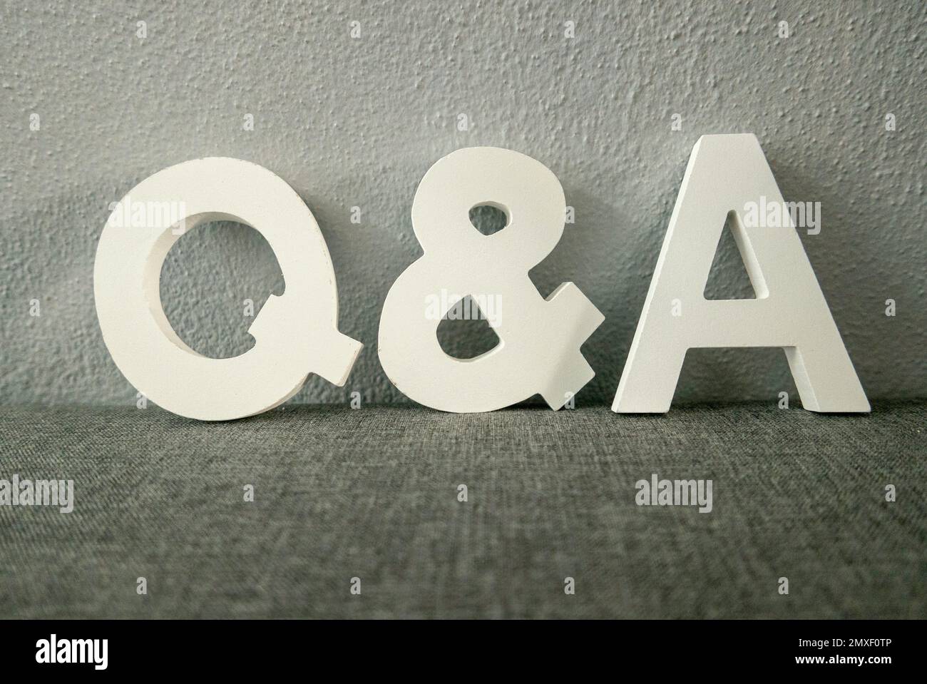 Question and answers concept. Wooden alphabet of letter q and a Stock ...