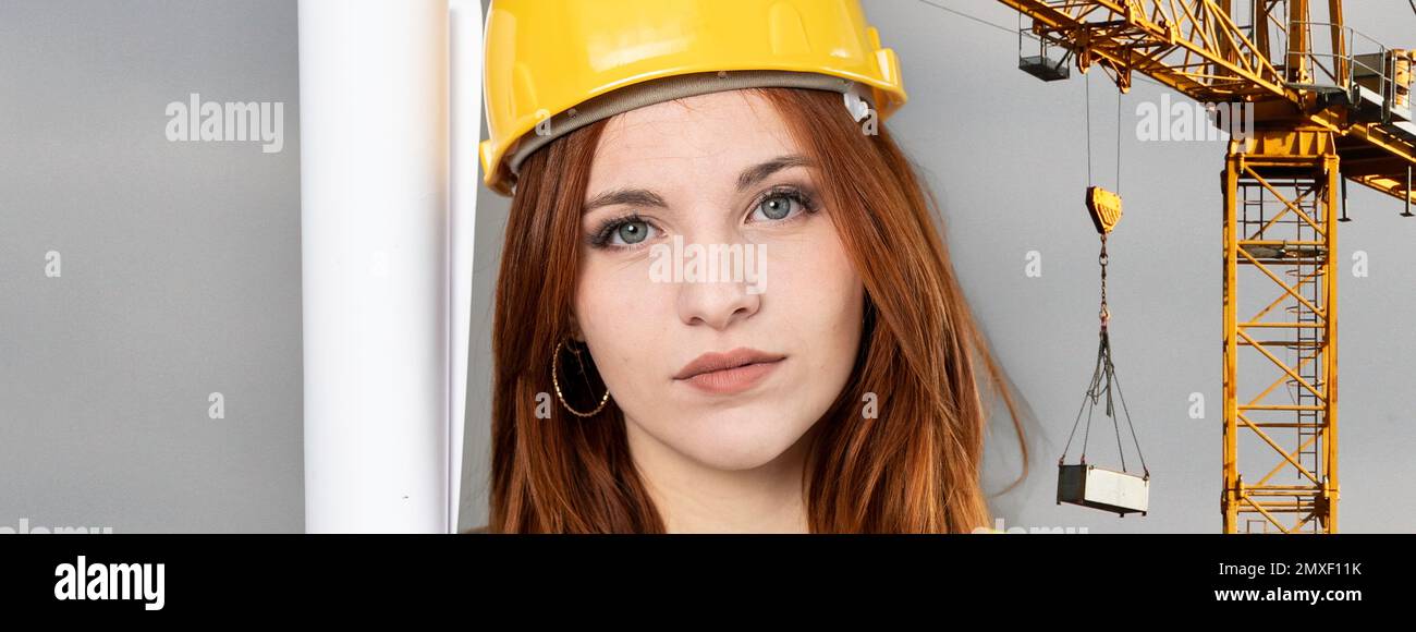 Horizontal banner or header with young female redhead worker of ...
