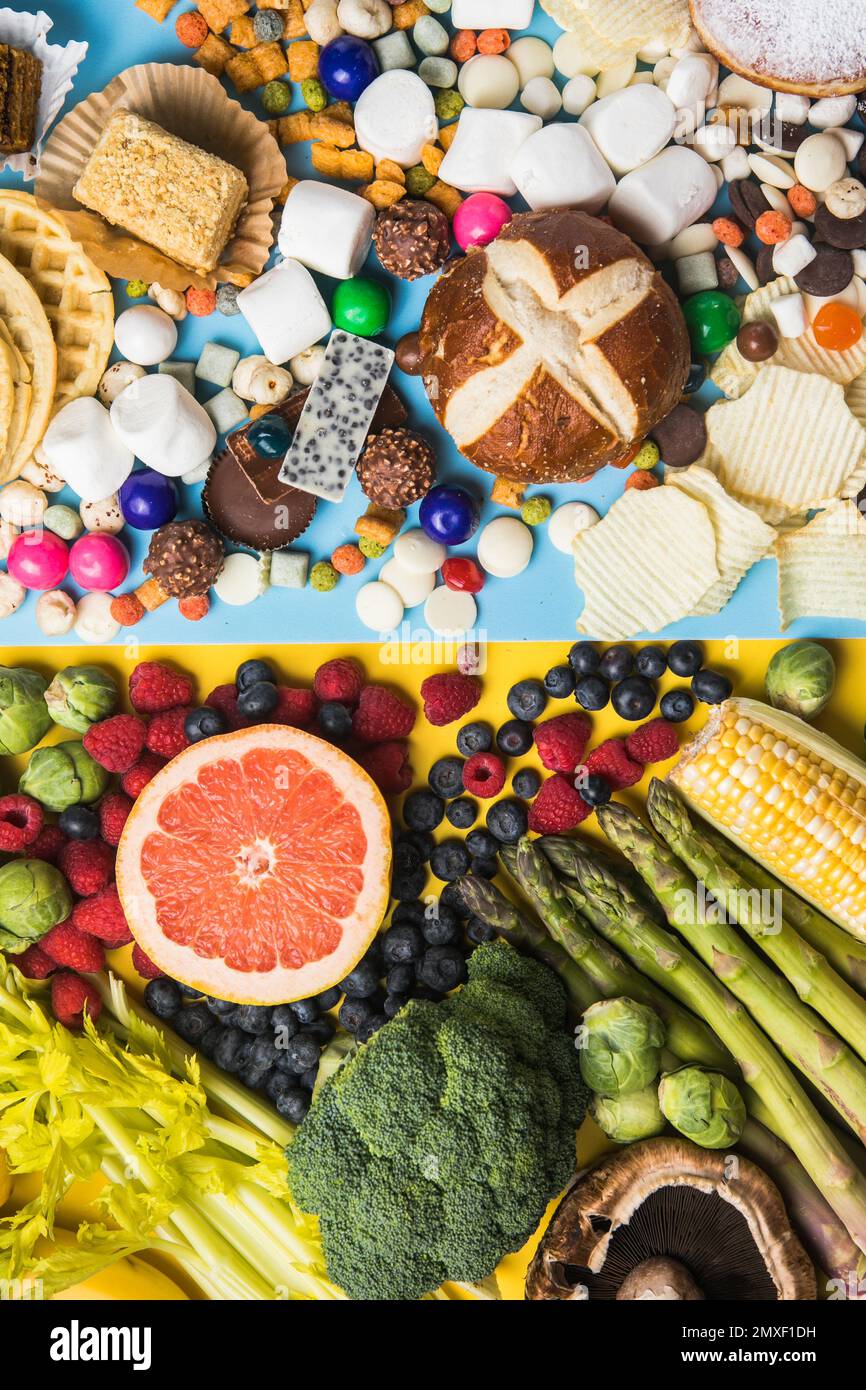 Healthy and unhealthy food background from fruits and vegetables vs ...