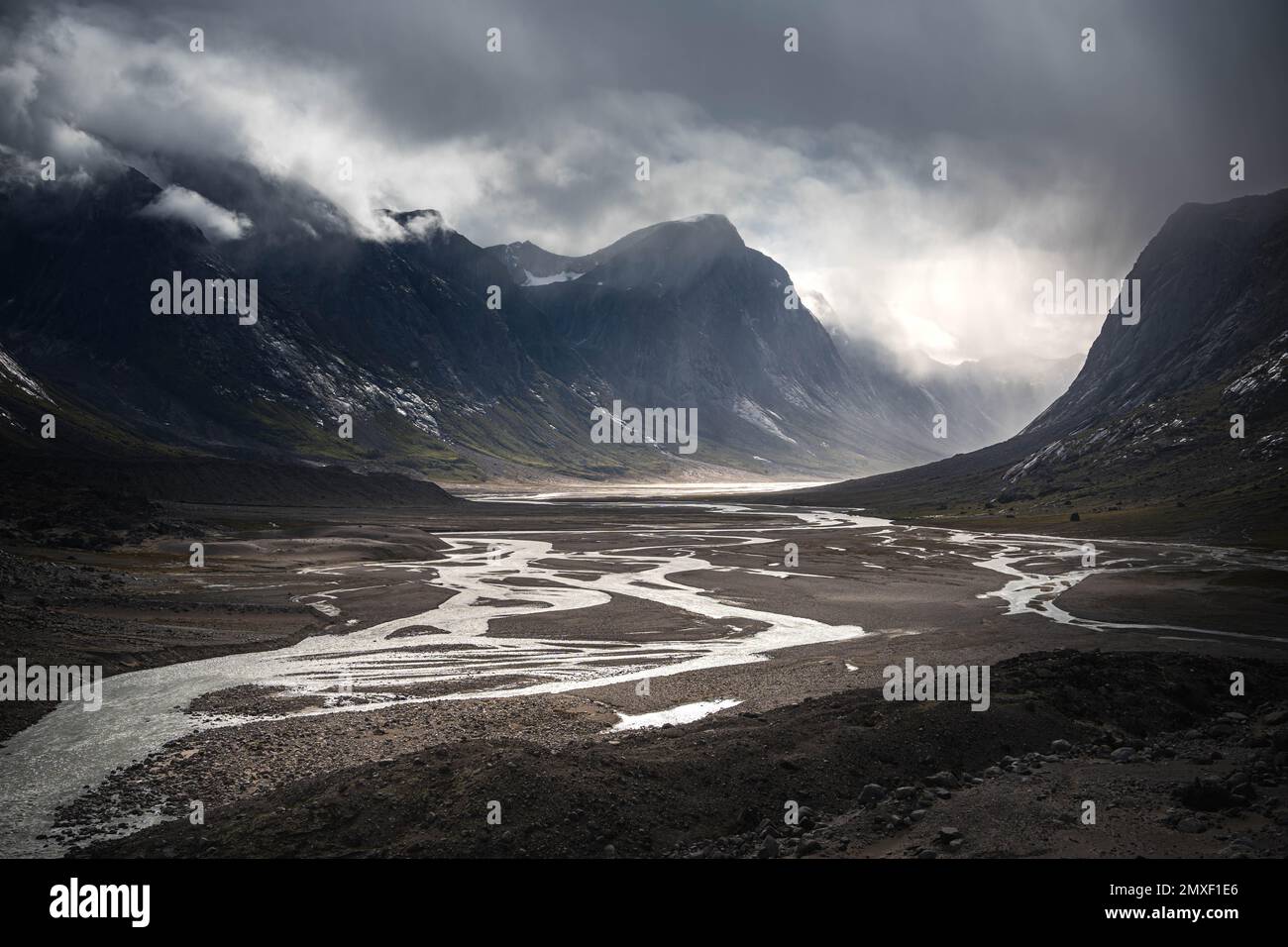 Southwest face of Mt. Thor, highest vertical cliff on Earth, on a ...