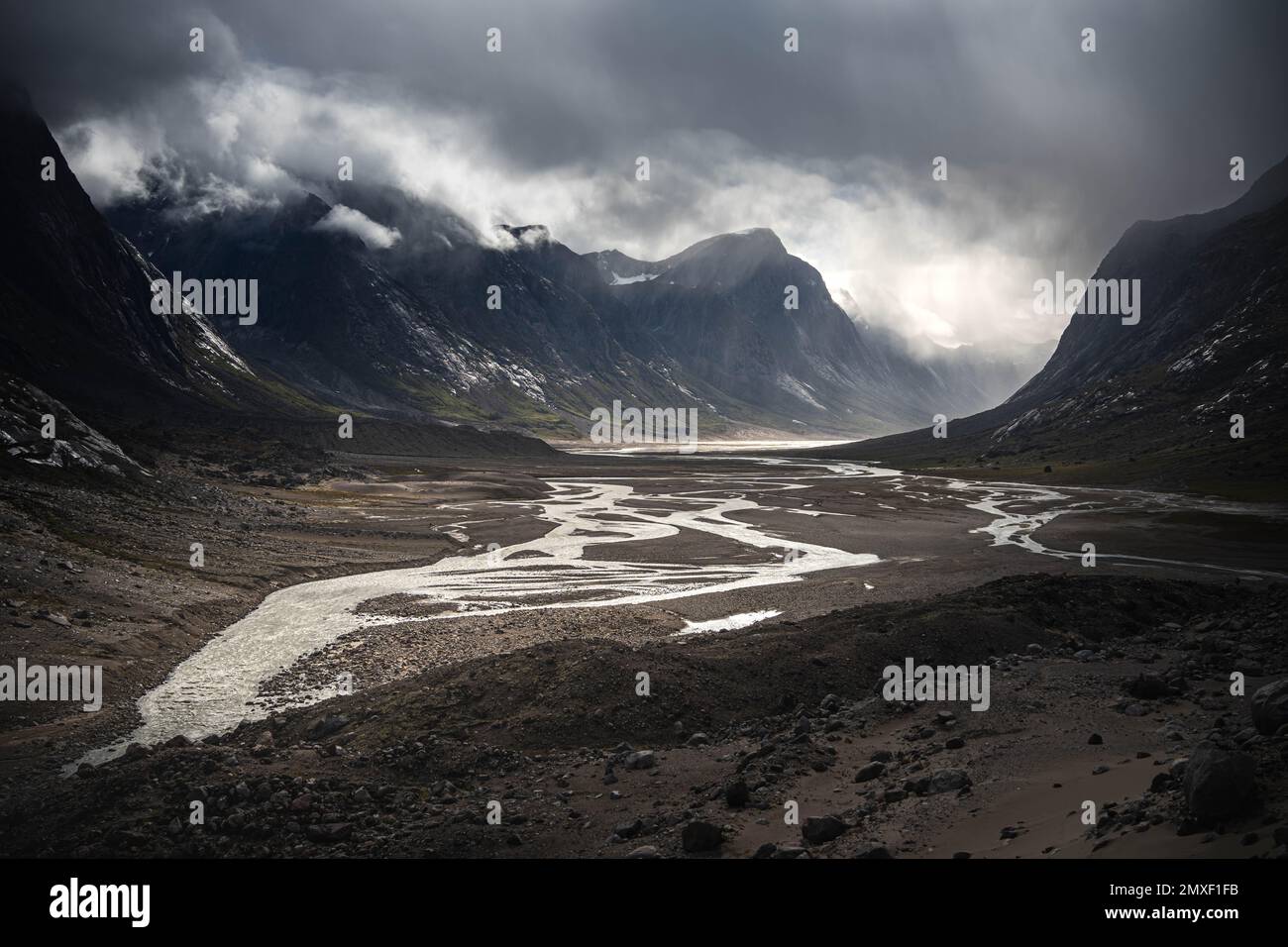Southwest face of Mt. Thor, highest vertical cliff on Earth, on a ...