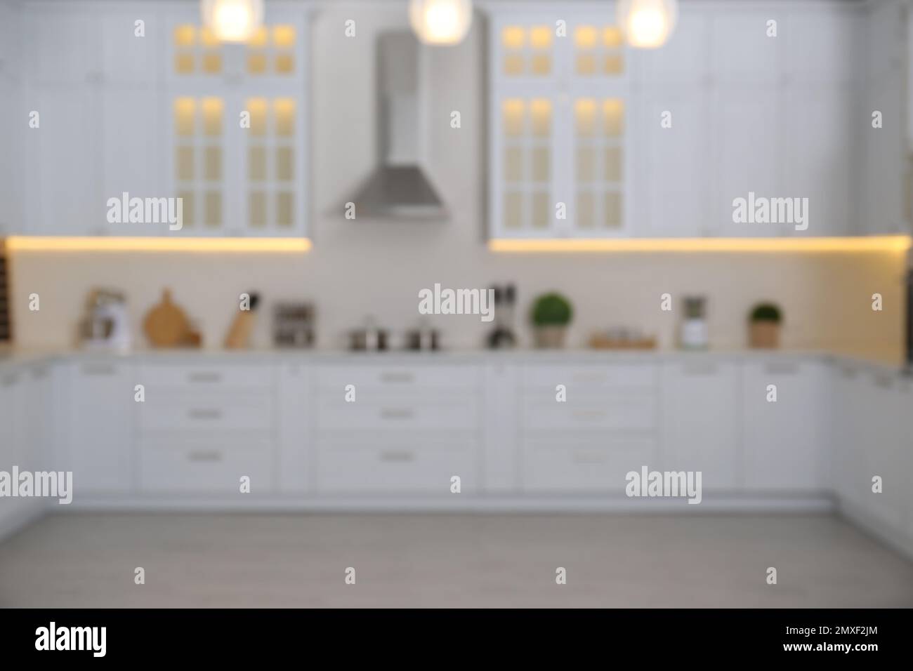 Blurred view of modern stylish kitchen interior Stock Photo - Alamy