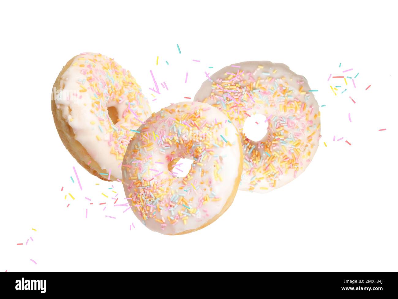 Set of falling delicious donuts on white background Stock Photo - Alamy