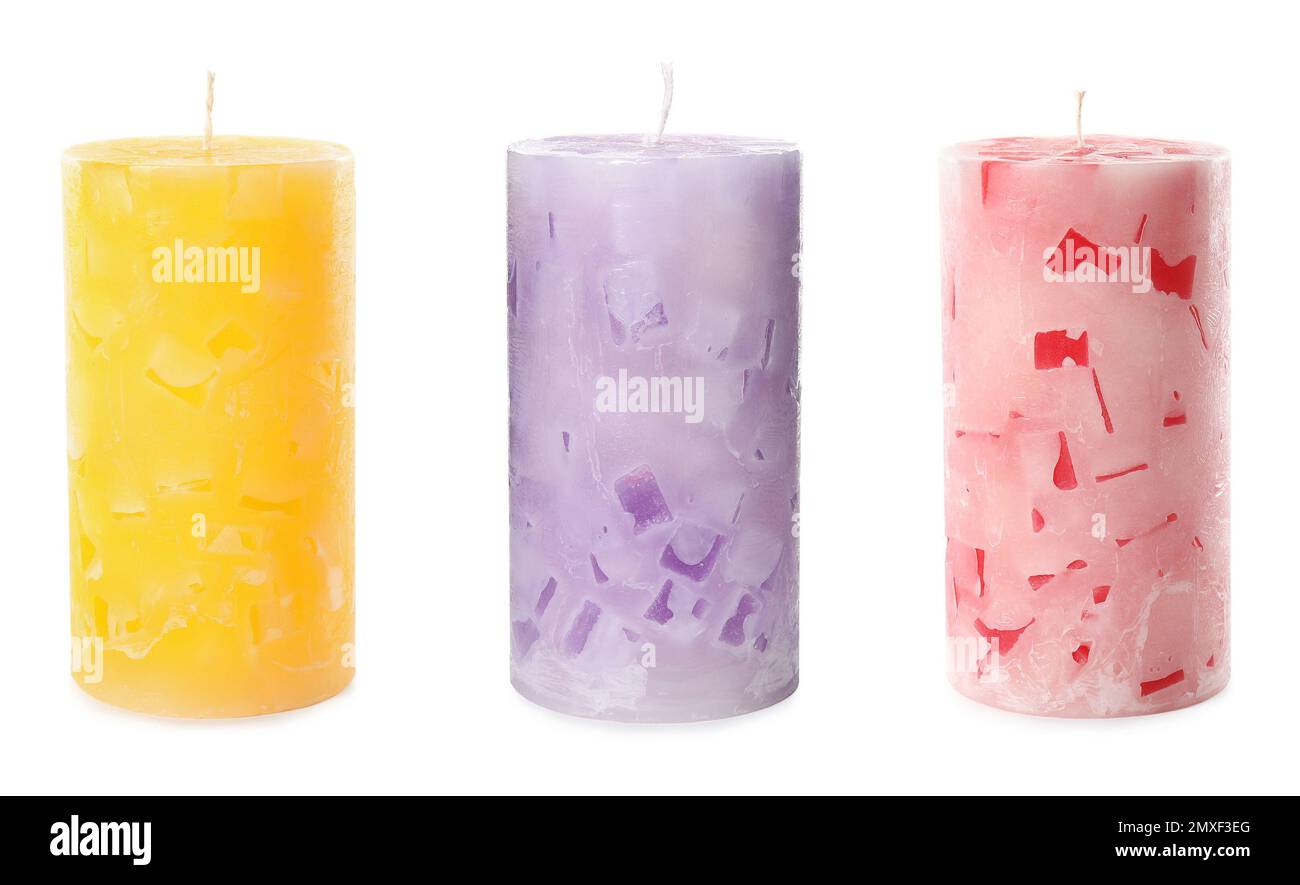 Set of color wax candles on white background Stock Photo - Alamy