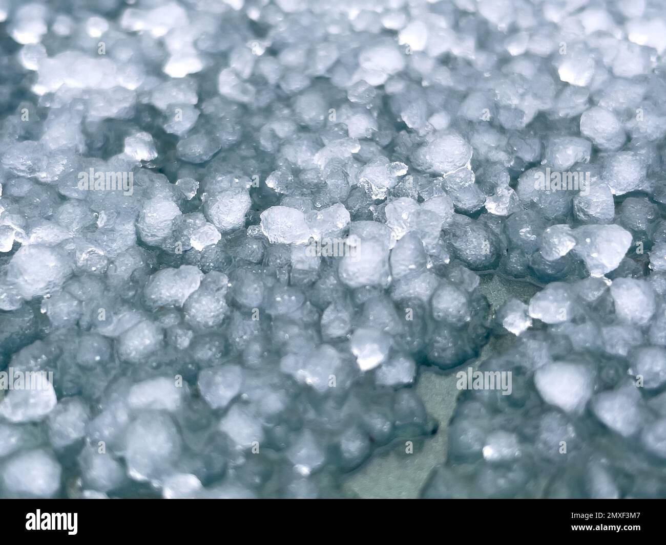 Large hailstones on a dark background. background, texture. Close-up ...