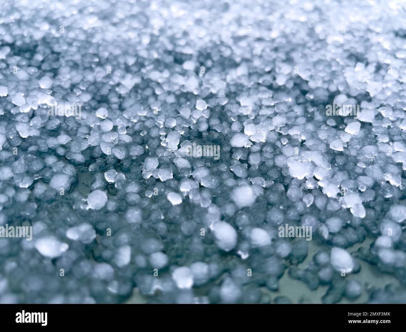 Large hailstones on a dark background. background, texture. Close-up ...