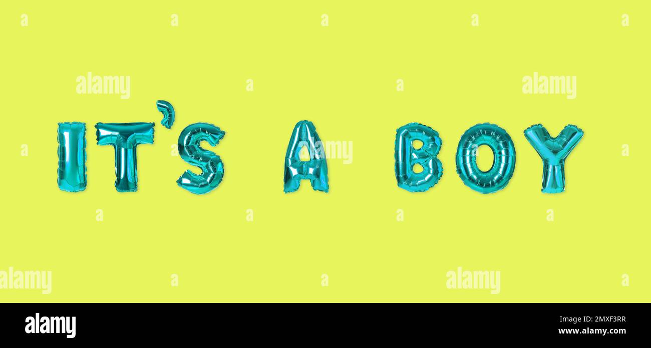 Phrase ITS A BOY made of foil balloon letters on yellow background ...