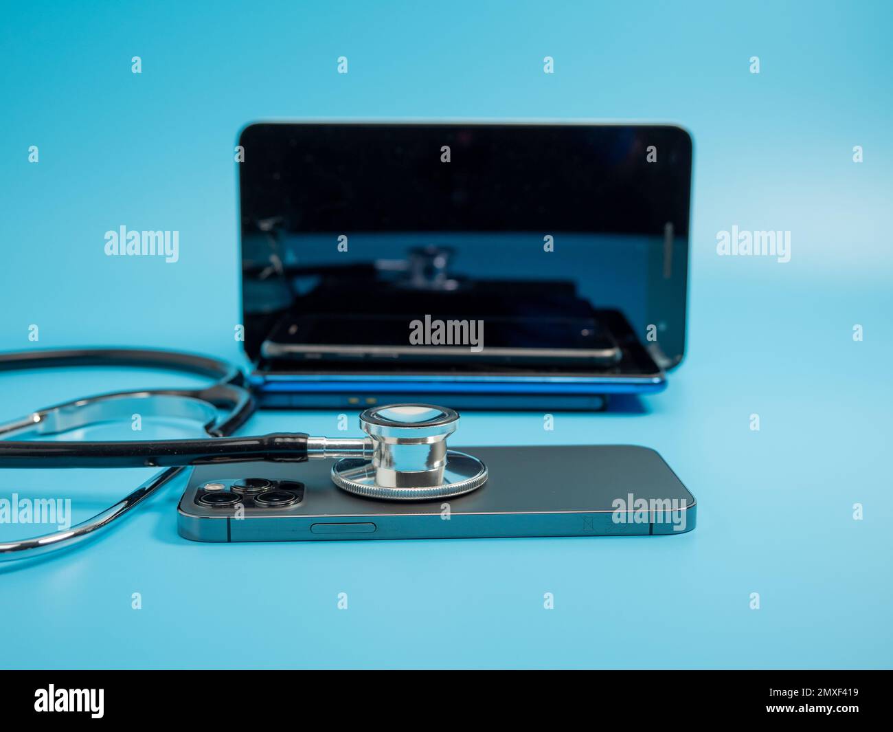 Smartphone and medical stethoscope. Smartphone diagnostics and repair ...
