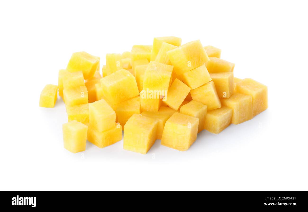 Raw yellow carrot cubes isolated on white Stock Photo - Alamy