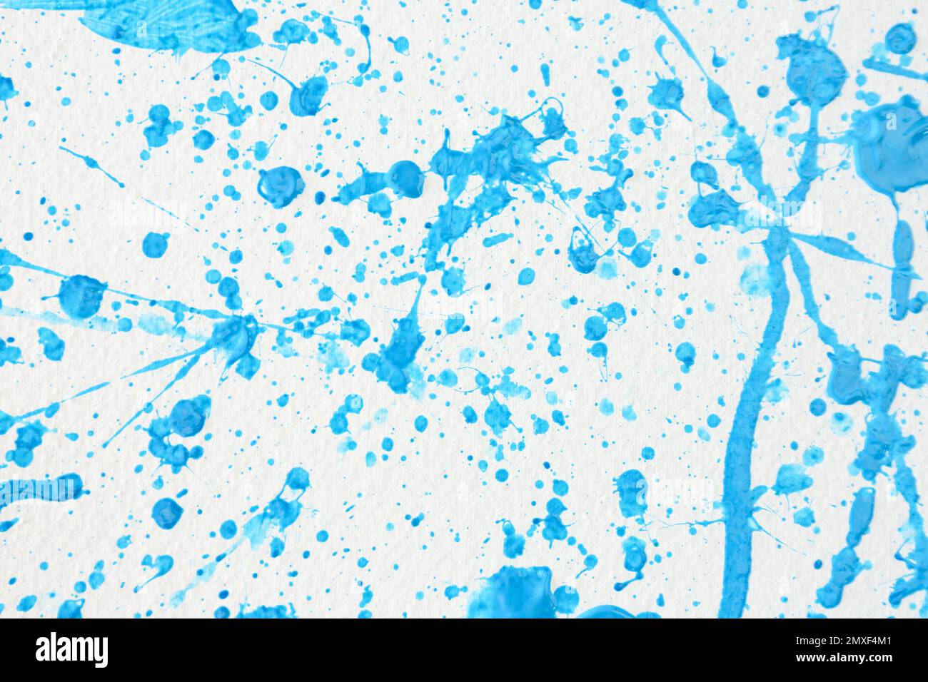 Blue paint splashes on white canvas as background. Art and creativity ...