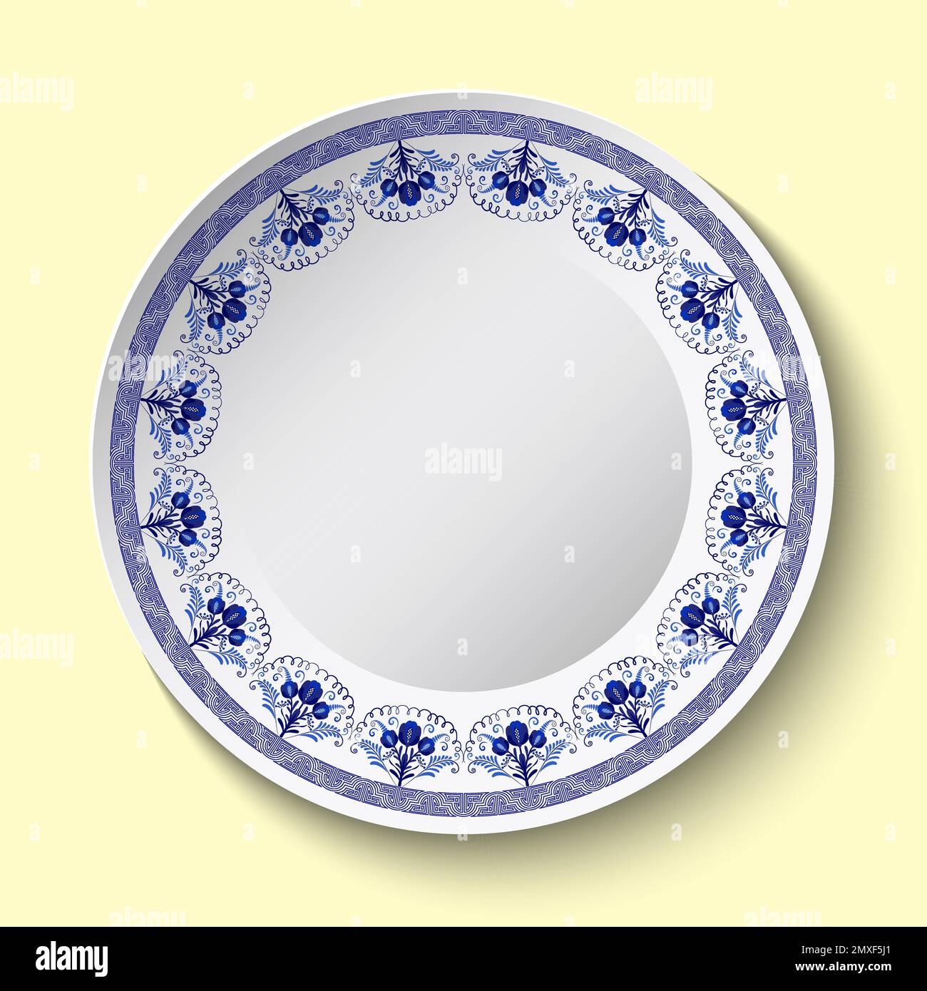 White porcelain or pottery plate with blue floral ornament. Stylized ... White porcelain or pottery plate with blue floral ornament. Stylized ...
