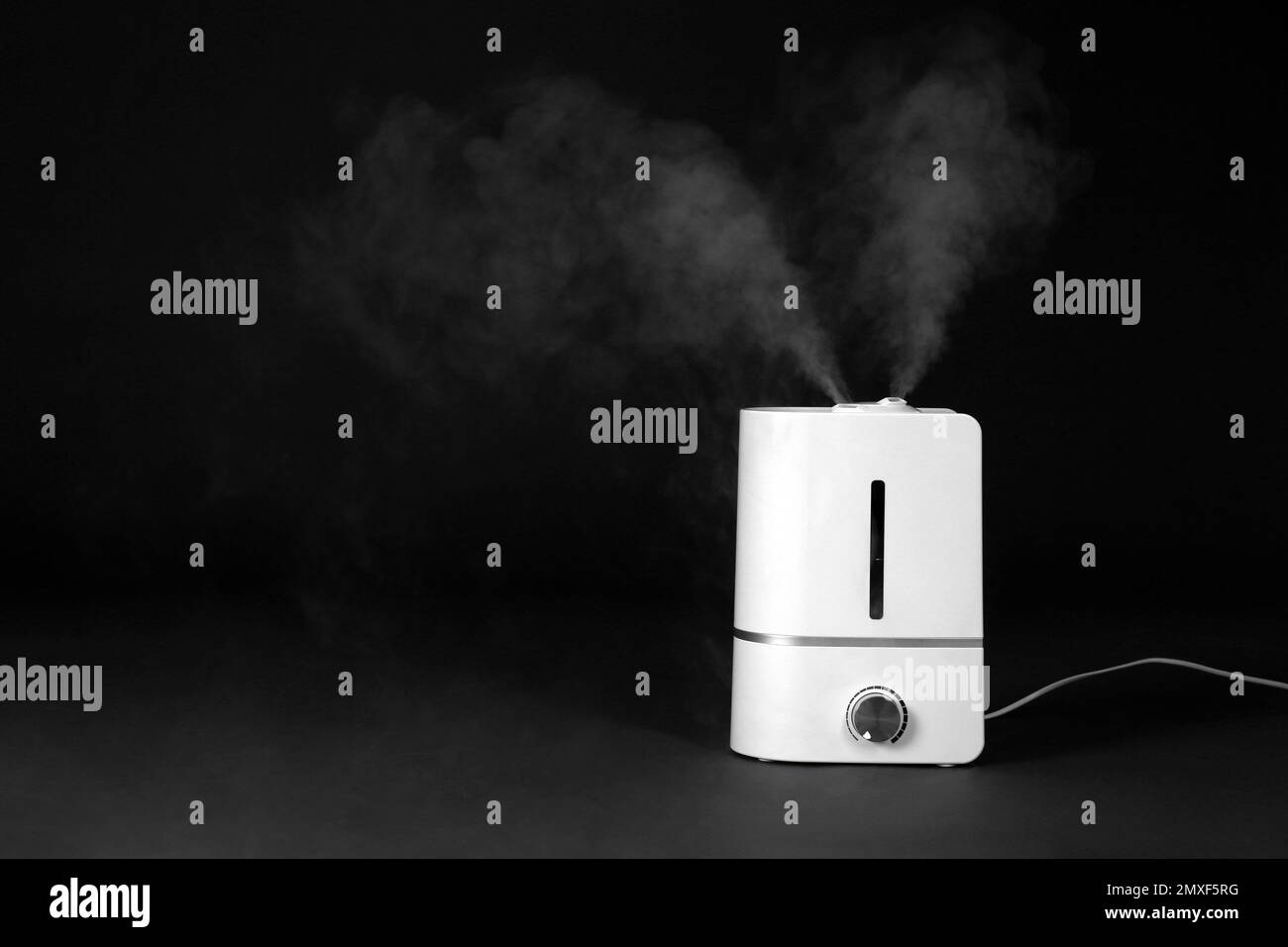 Modern air humidifier on black background. Space for text Stock Photo ...