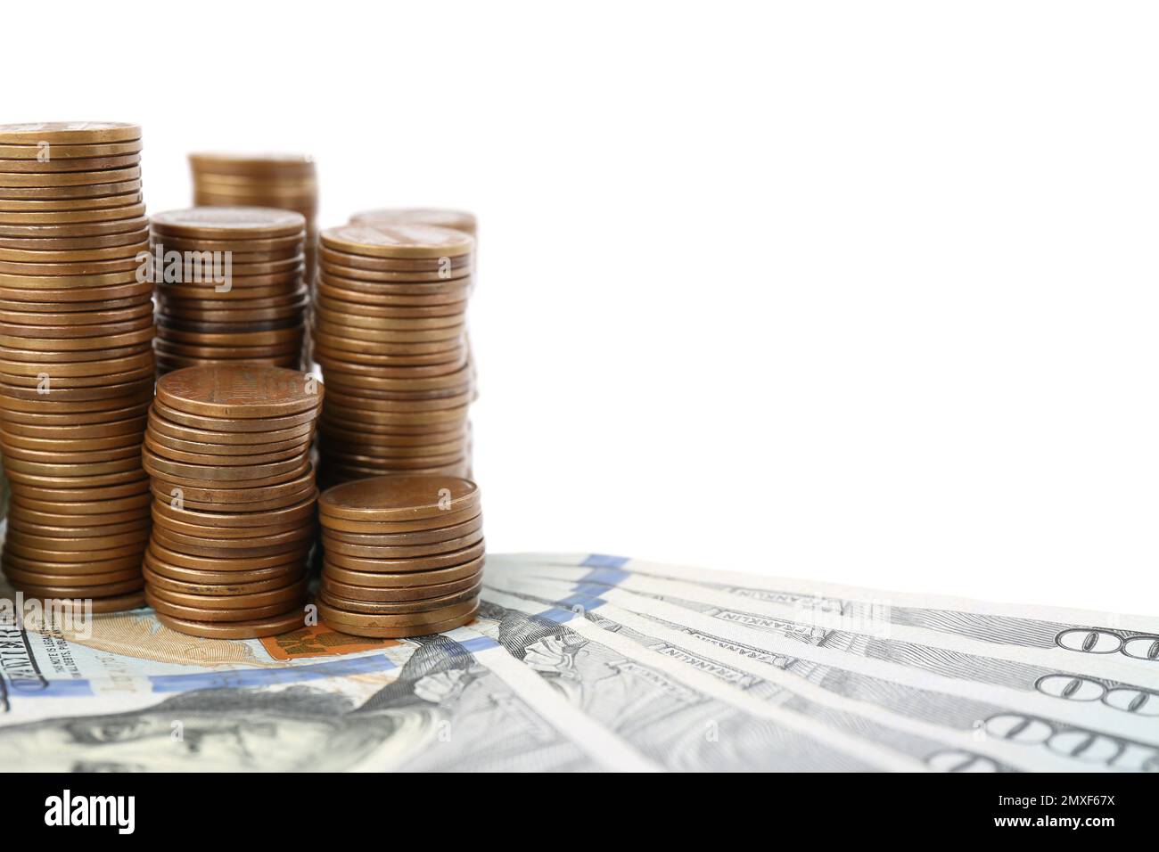 Dollar bills and coins on white background Stock Photo - Alamy
