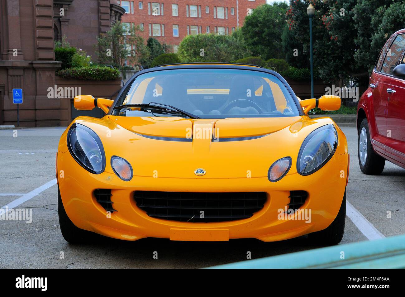 A yellow Lotus Elise parked outside Pacific Union Club in San Francisco ...