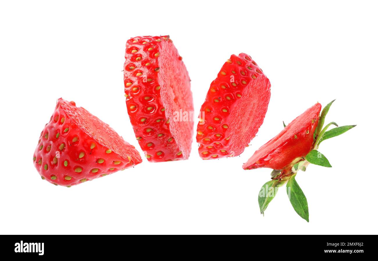 Pieces of ripe strawberry falling on white background Stock Photo - Alamy