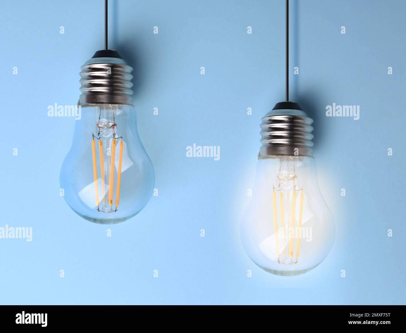 Idea concept. Light bulbs on light blue background Stock Photo - Alamy