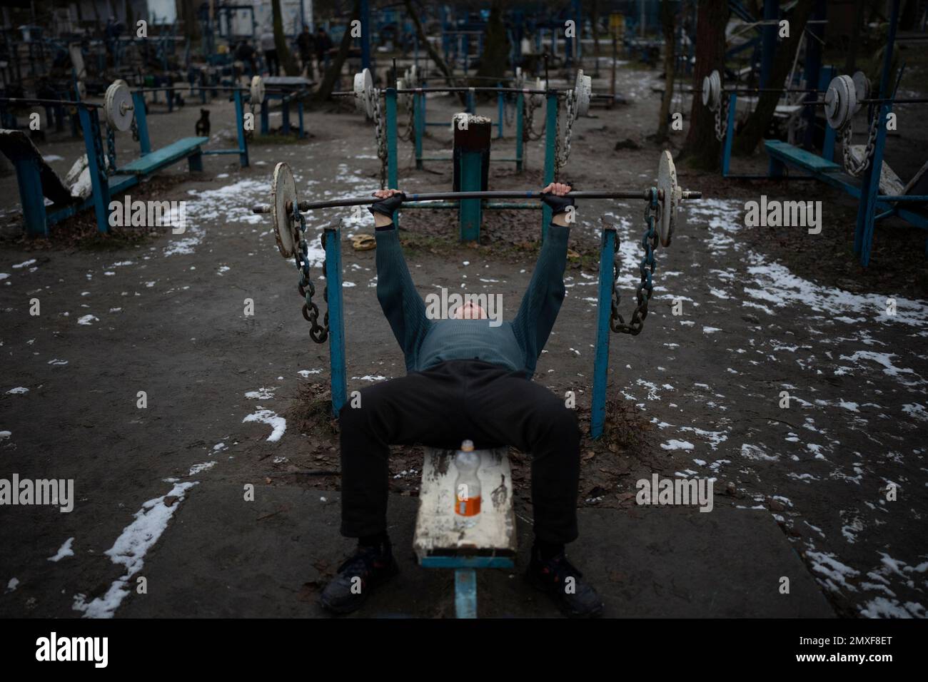 A man exercises at the Kachalka outdoor gym on Dolobetskyi island in ...