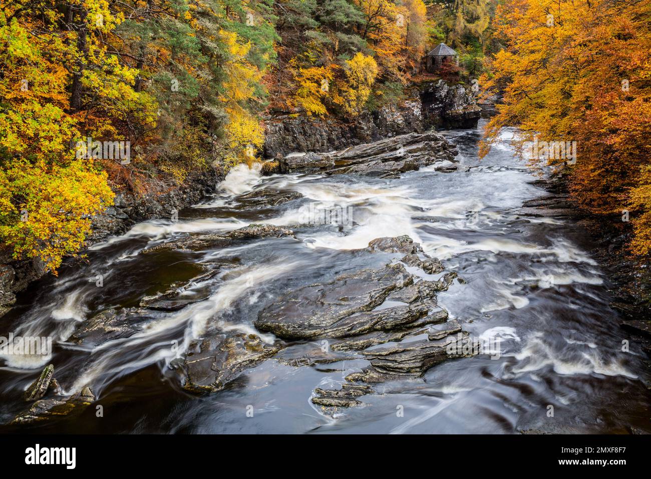 Water flowing under the bridge at Invermoriston falls in the Scottish ...