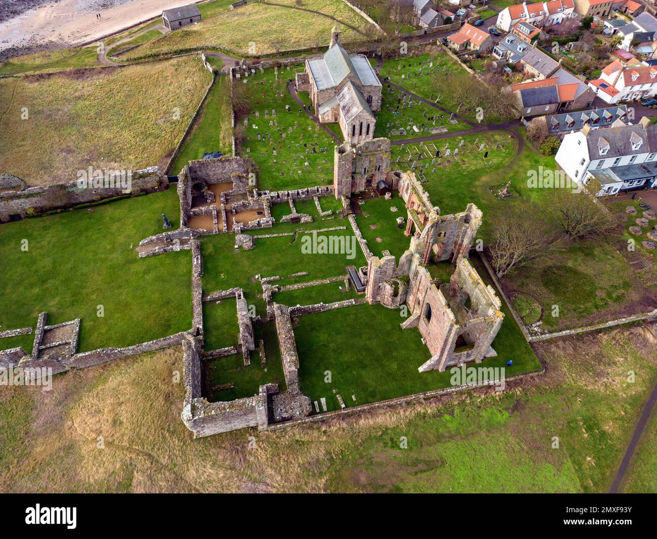 Aerial view of the medieval ruins of Lindisfarne Priory on Holy Island ...