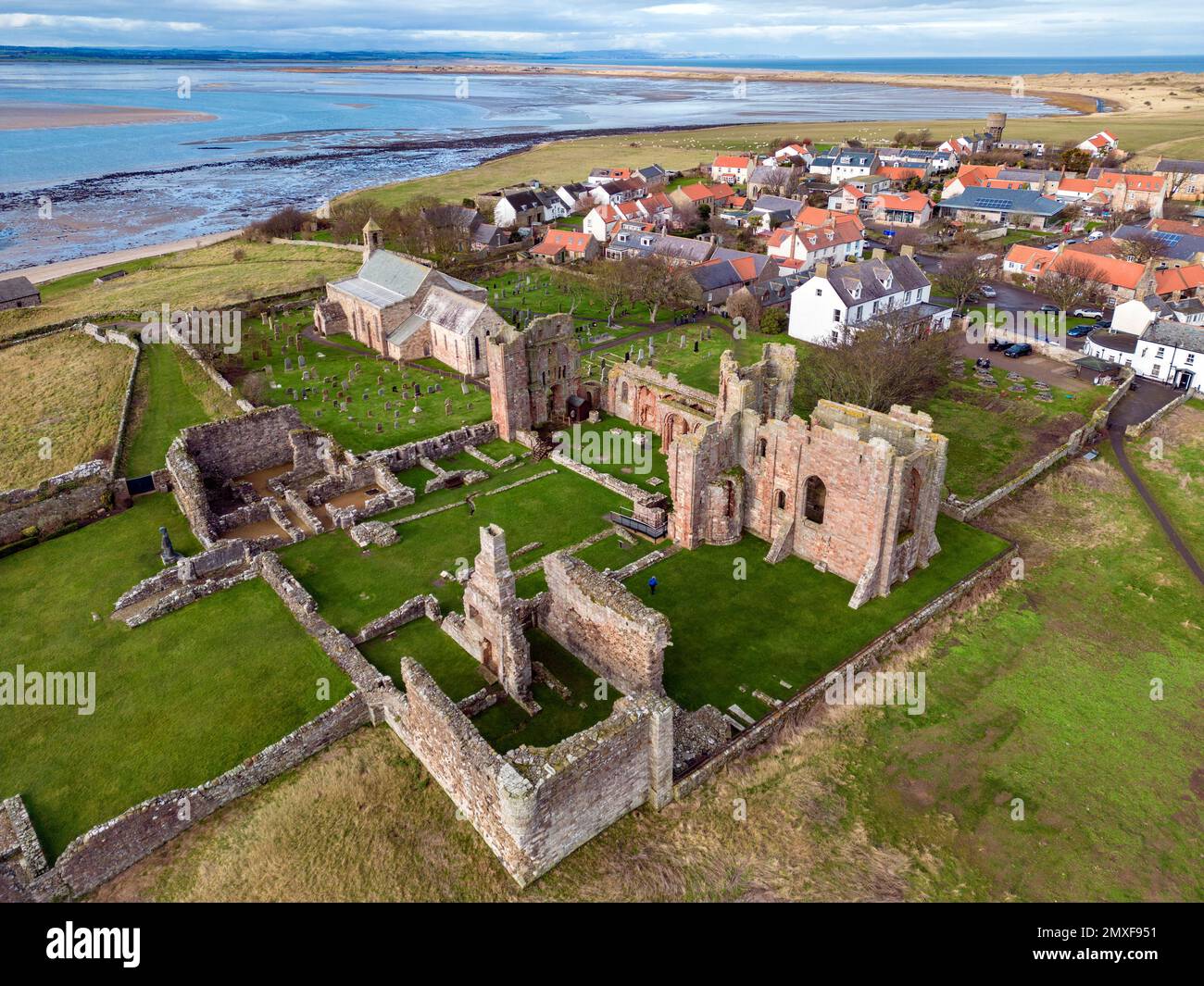 Aerial view of the medieval ruins of Lindisfarne Priory on Holy Island ...